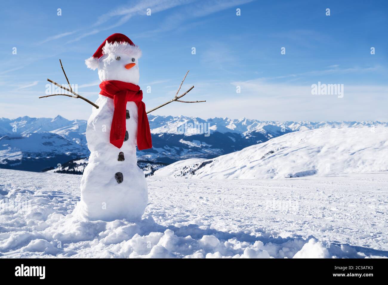 Low Angle View Of An Incomplete Snowman With Hat And Scarf On Snowy ...