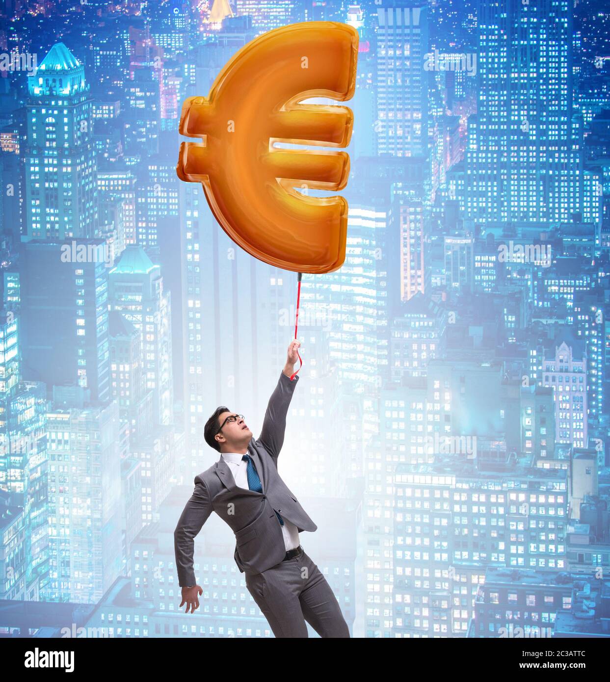 The businessman flying on euro sign inflatable balloon Stock Photo - Alamy