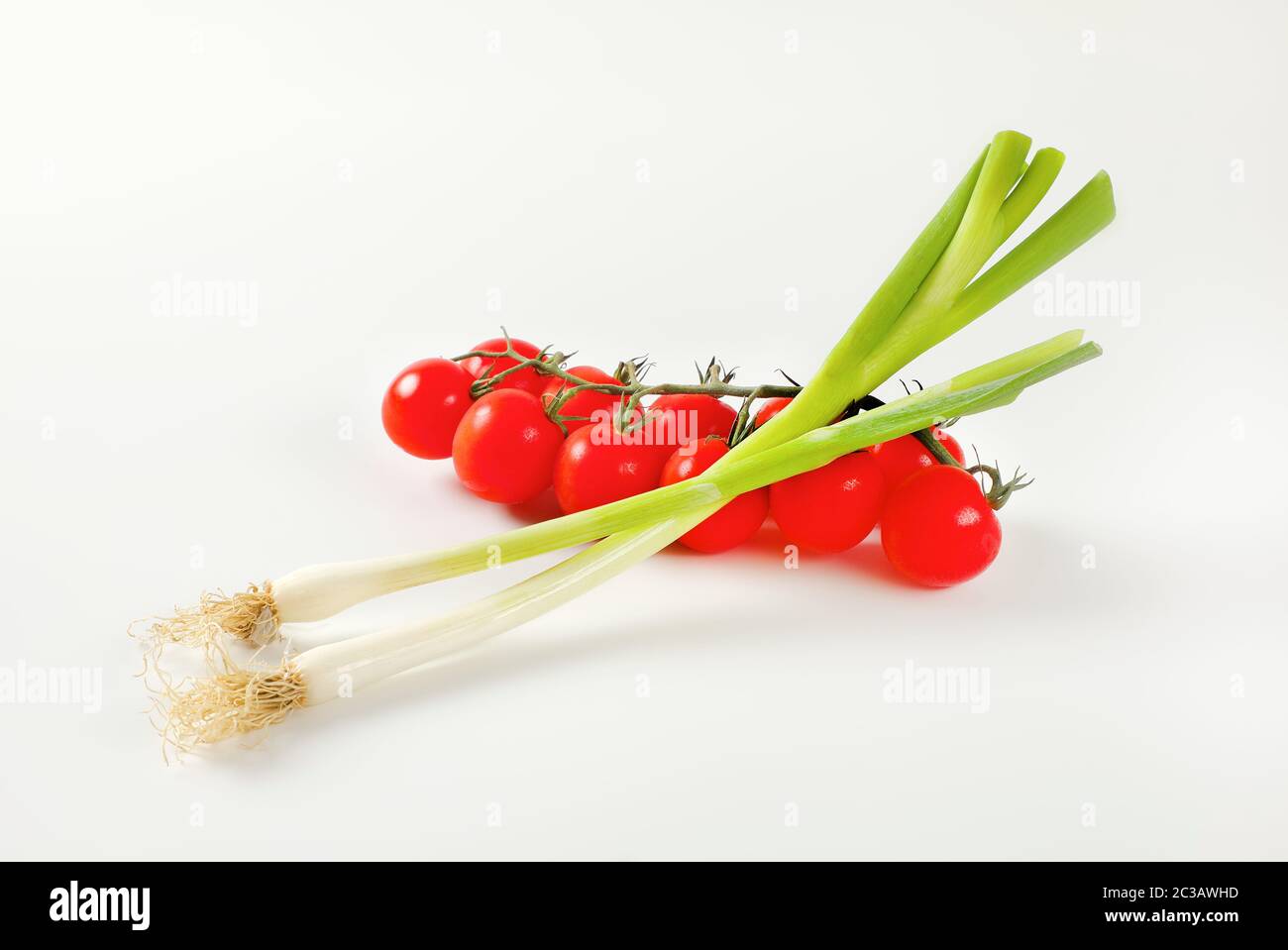 Bunch of fresh red tomatoes and spring onions Stock Photo - Alamy
