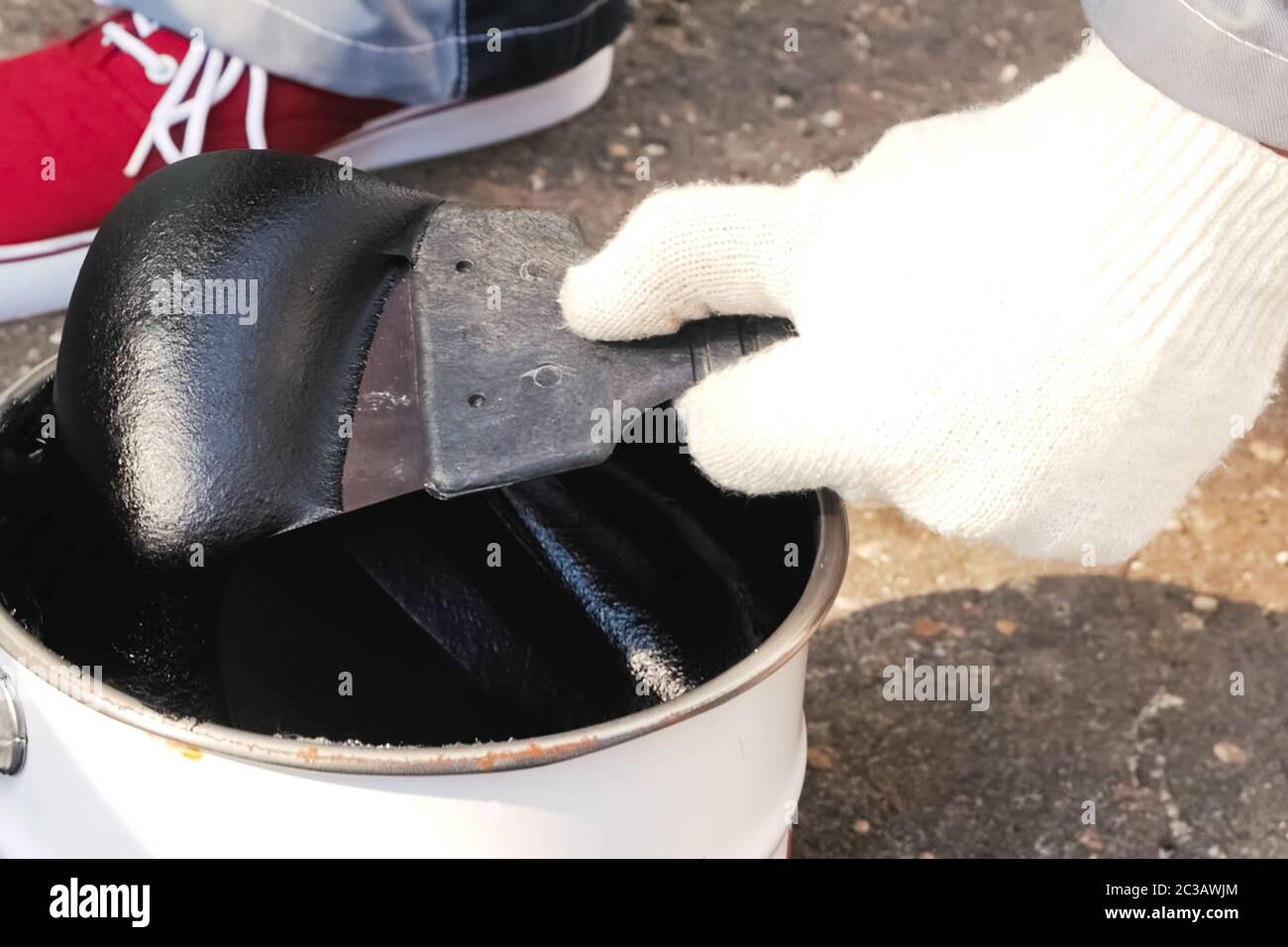 Bituminous mastic on a spatula. building mixtures and coatings Stock ...