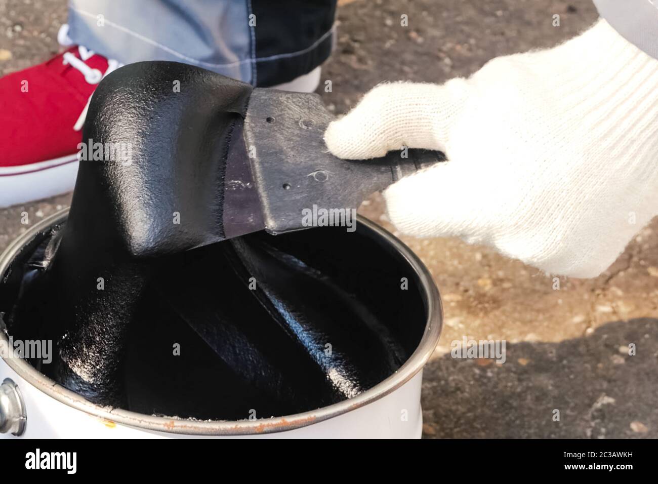 Bituminous mastic on a spatula. building mixtures and coatings Stock ...