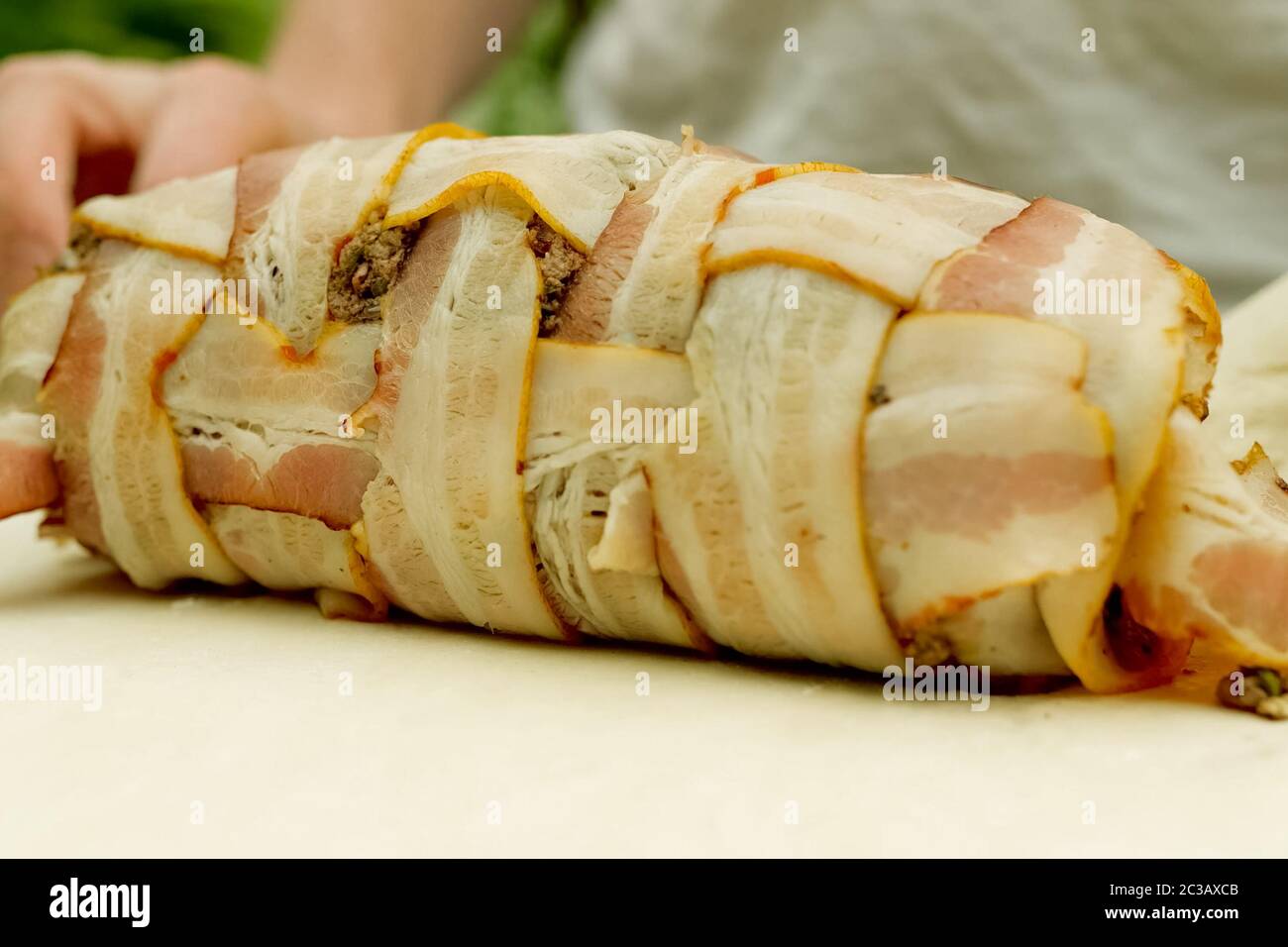 Folding raw meatloaf, cooking meatloaf. Folding raw Stock Photo - Alamy