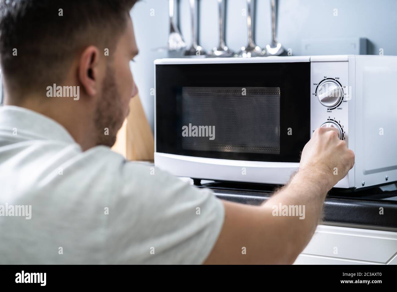 Microwave food male hi-res stock photography and images - Alamy