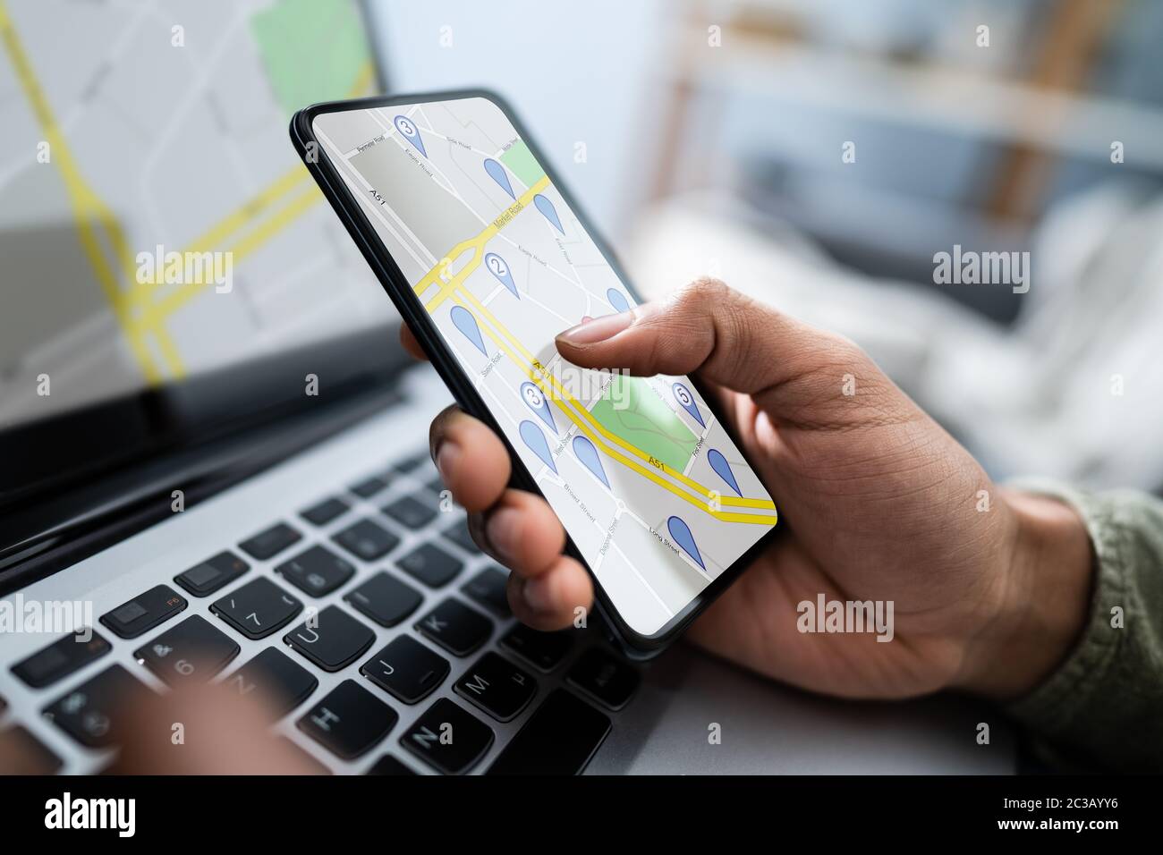 Close-up Of A Person's Hand Using GPS Navigation Map On Mobile Phone ...
