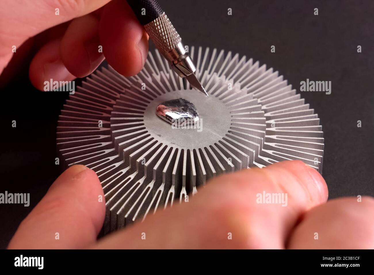 Liquid metal on an aluminum processor cooling radiator Stock Photo - Alamy