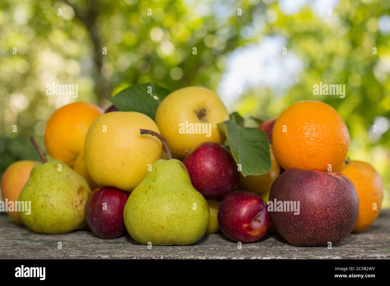 fruits in wooden table, outdoor Stock Photo - Alamy