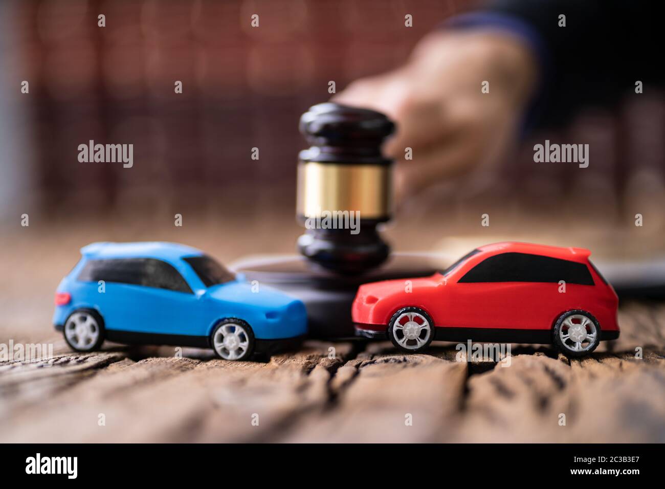 Two Cars In Front Of Gavel And Mallet And Judge Striking The Mallet ...