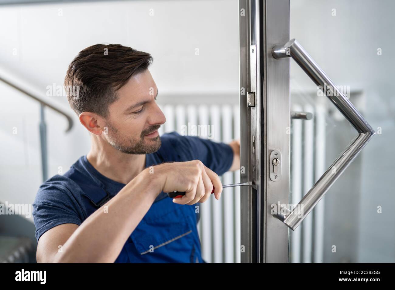 Young guy repairing servicing hi-res stock photography and images - Alamy