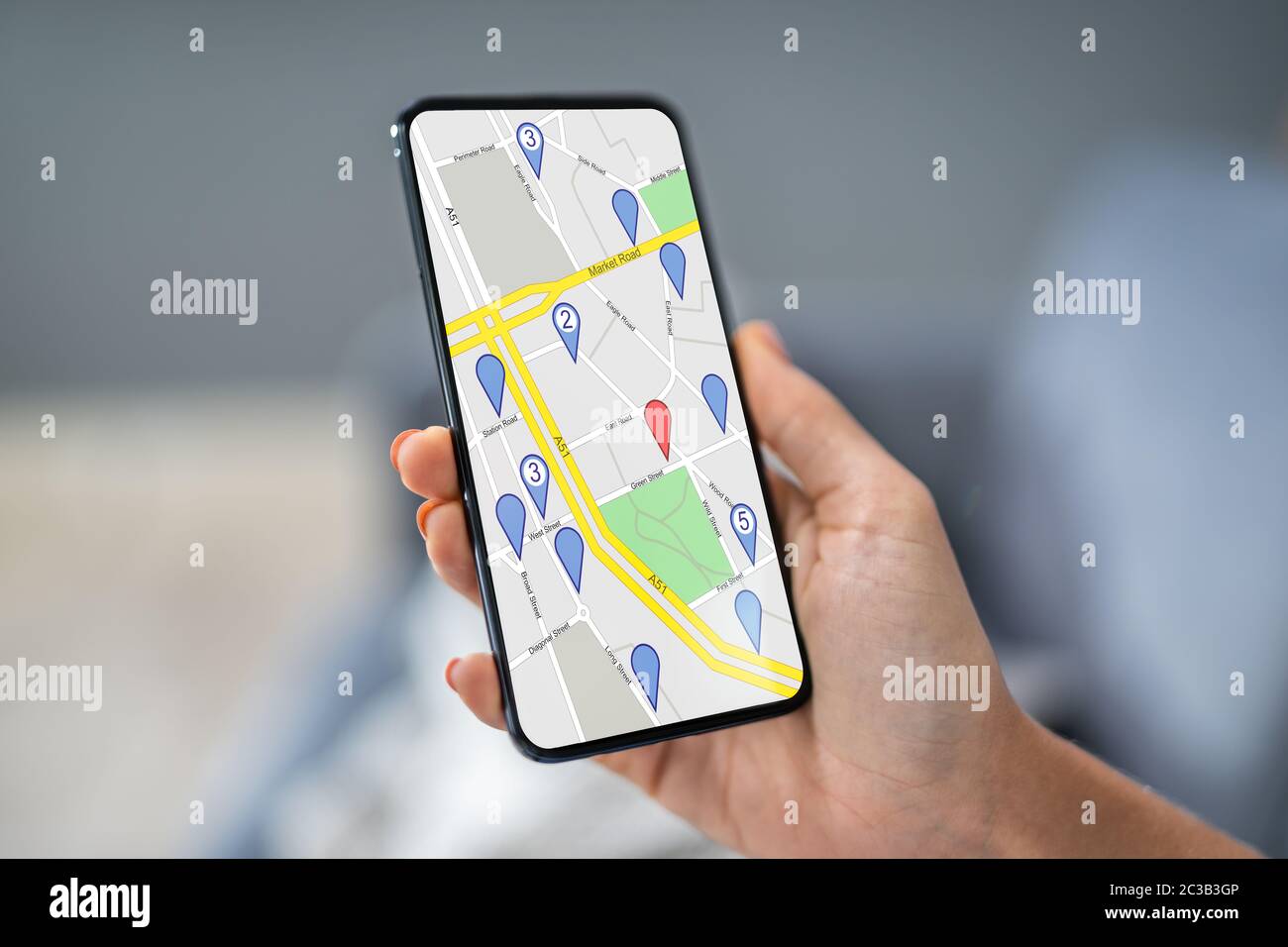 Close-up Of A Person's Hand Using GPS Navigation Map On Mobile Phone ...