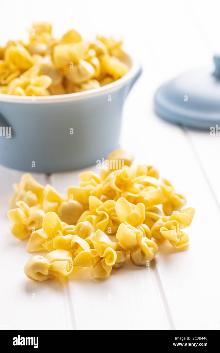 Italian stuffed pasta. Sacchettini pasta on white table Stock Photo - Alamy