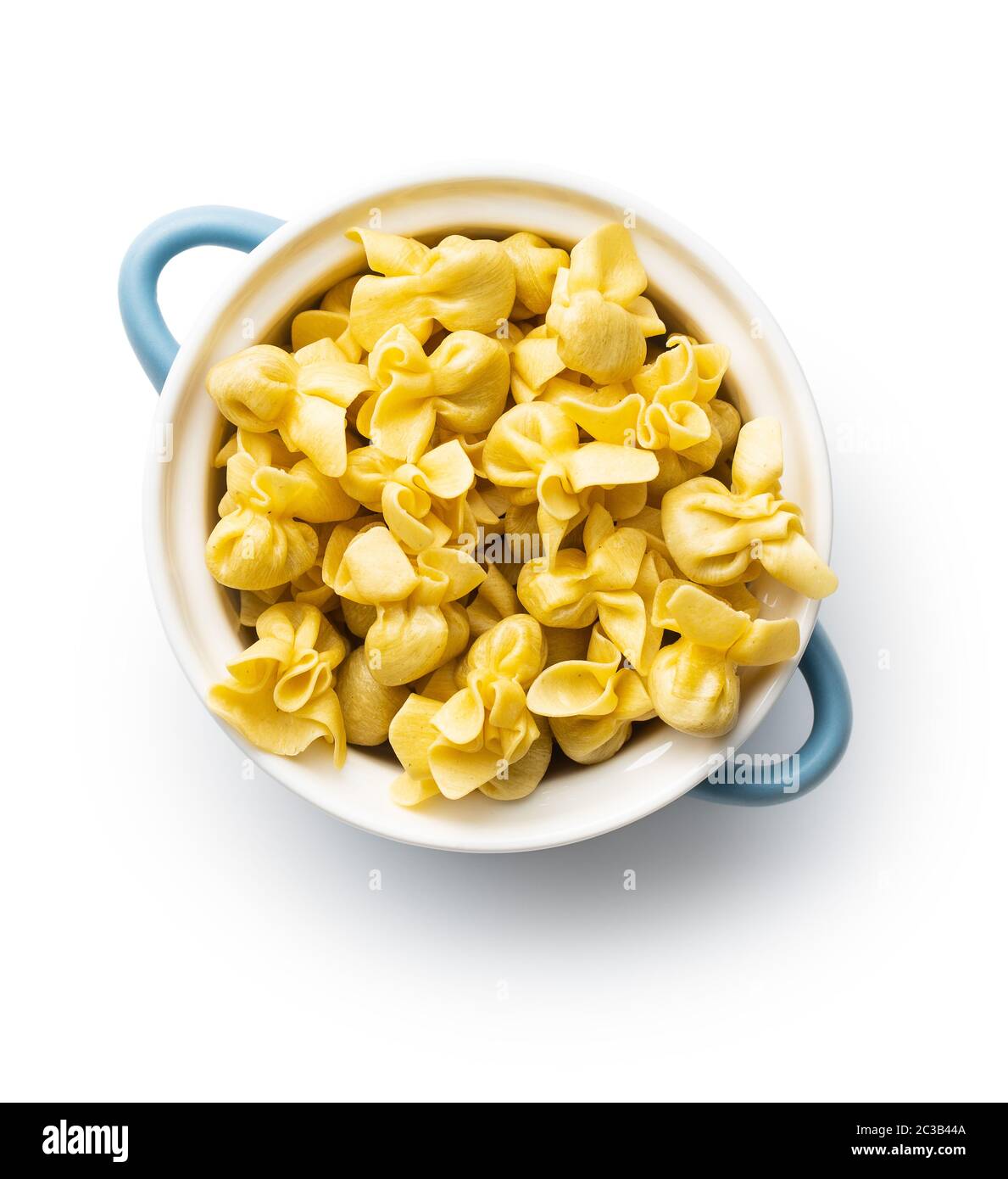 Italian stuffed pasta in pot. Sacchettini pasta isolated on white ...