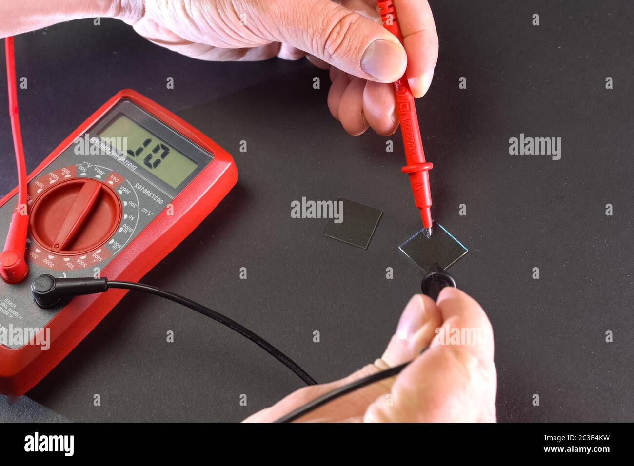 Measurement of product electrical parameters using a multimeter Stock ...