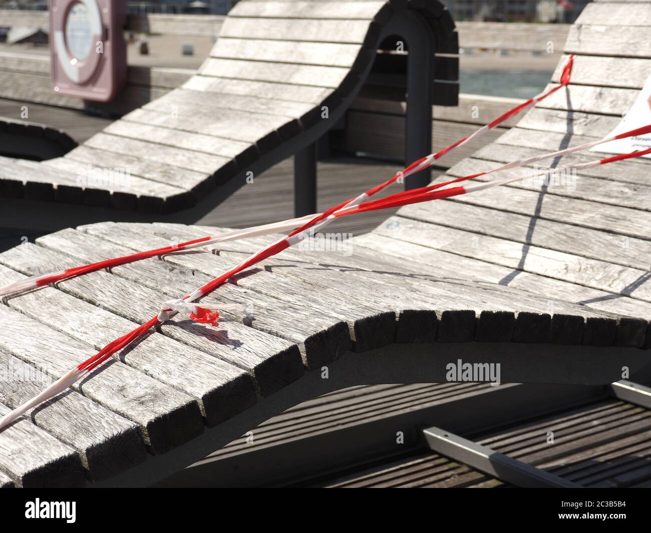 Wooden bed wrapped with barrier tape, social distance, COVID-19 ...