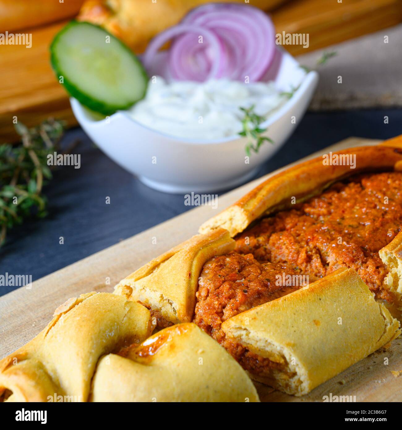 Pide with minced meat, spinach feta and sheep's cheese Stock Photo - Alamy