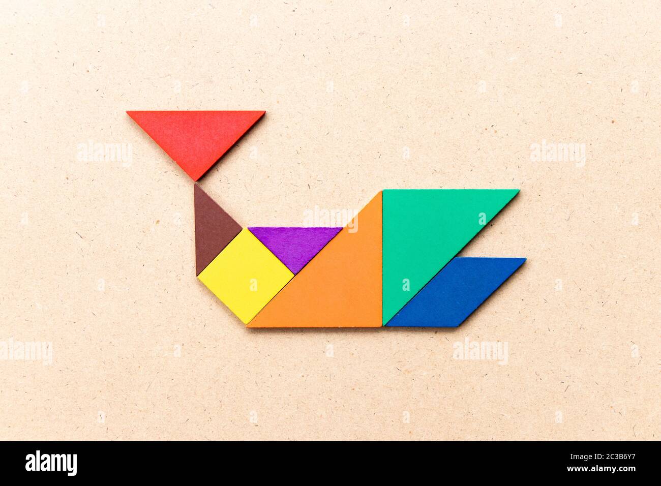 Color tangram puzzle in whale shape on wood background Stock Photo - Alamy