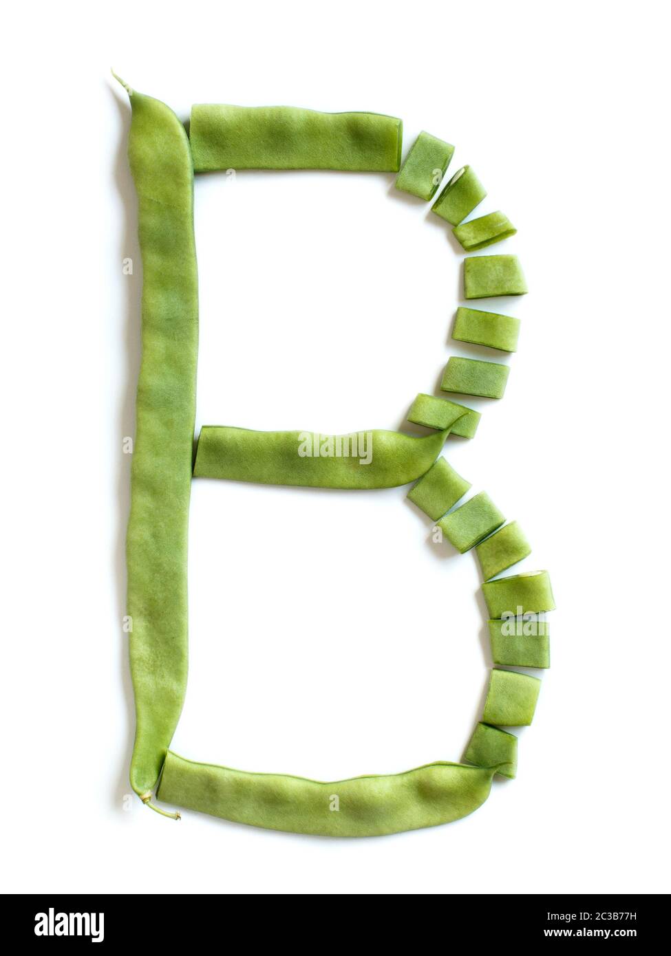 letter B made from Piattoni green beans top view isolated Stock Photo ...