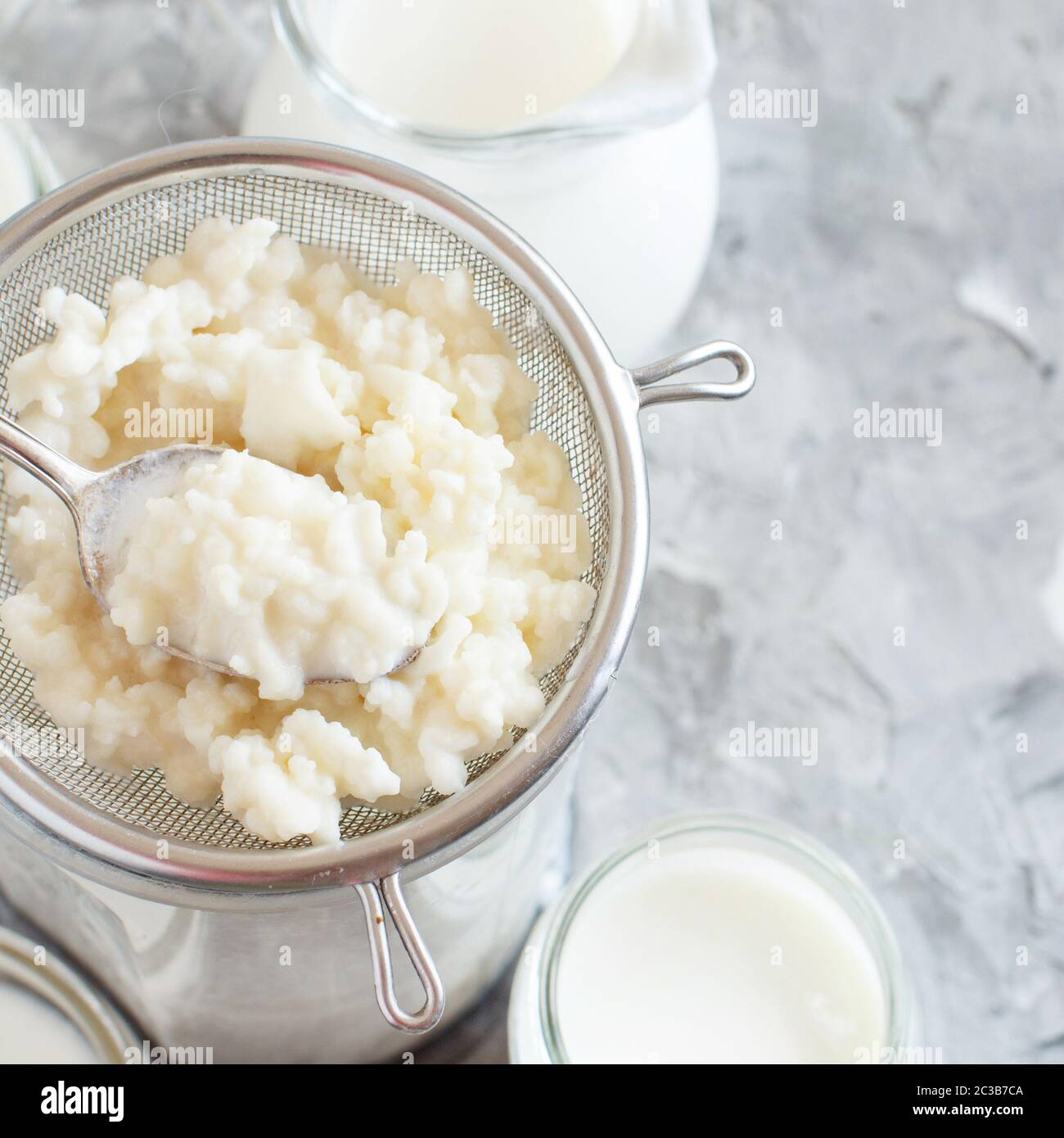 Kefir grains and fermented drink kefir close up Stock Photo - Alamy