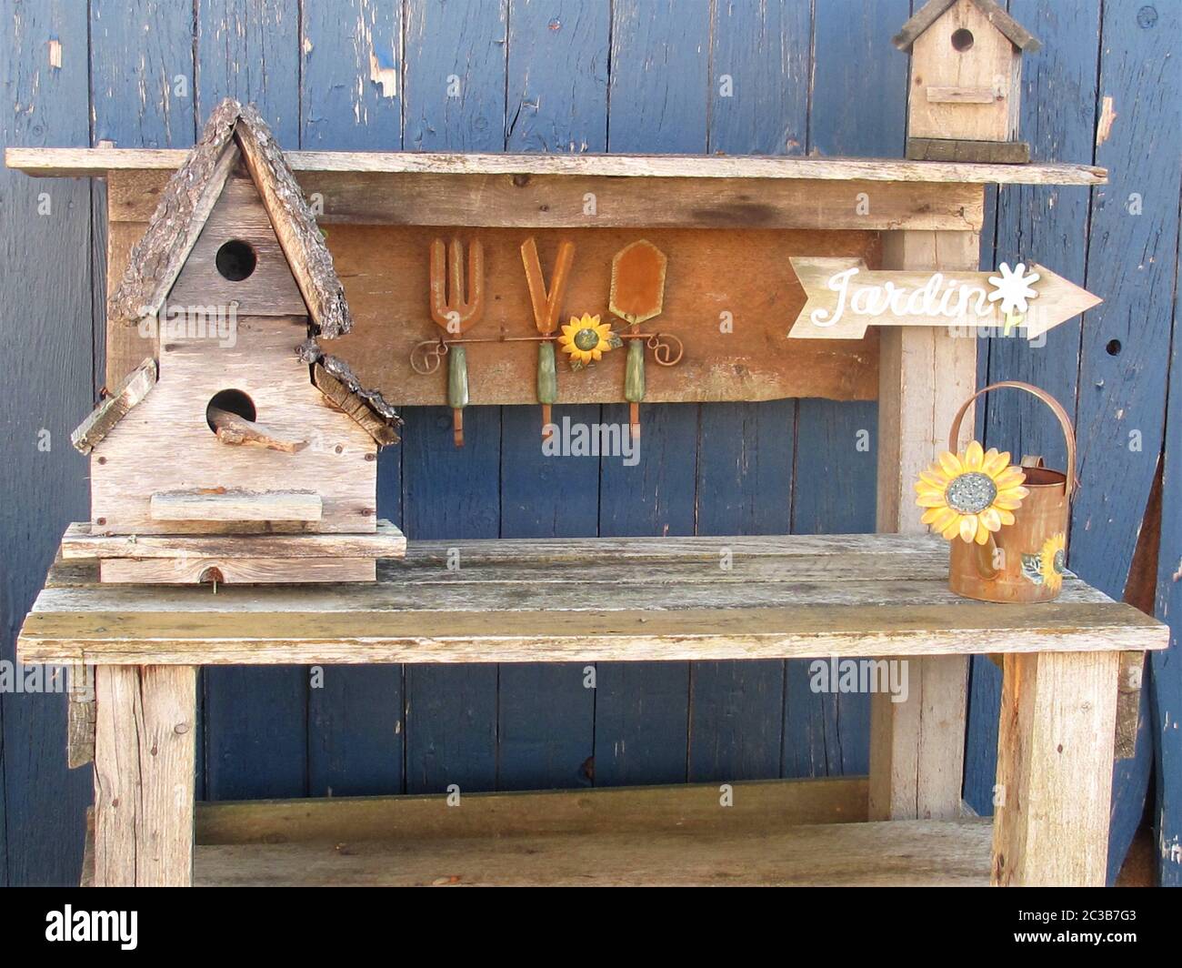 Hand crafted bird houses on wood table Stock Photo - Alamy