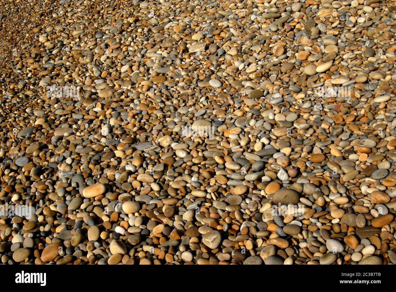 small wet pebble stones at the beach Stock Photo - Alamy