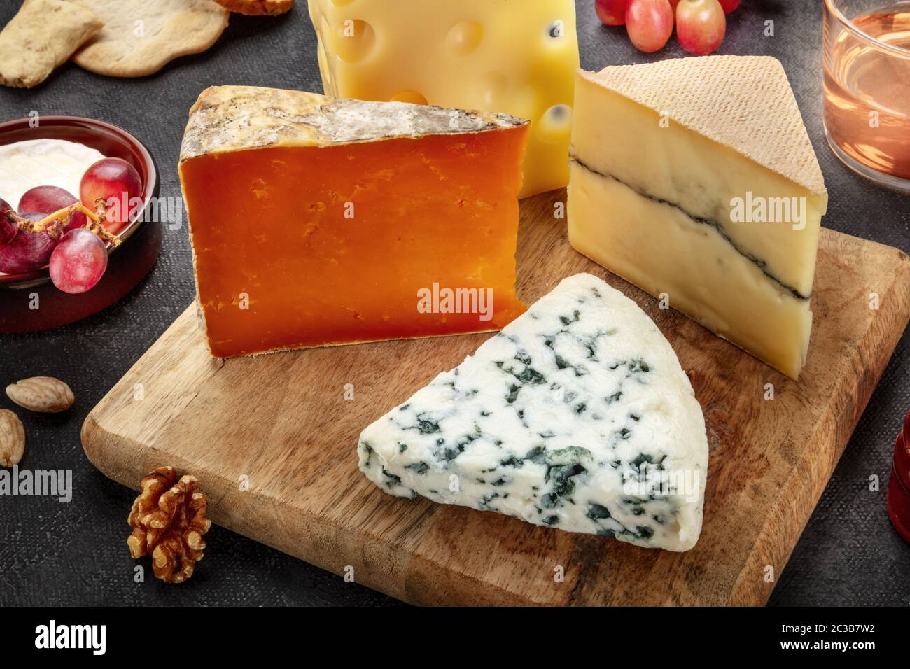 Cheese plate. Blue cheese, red Leicester, goat cheese, and Emmental, on ...