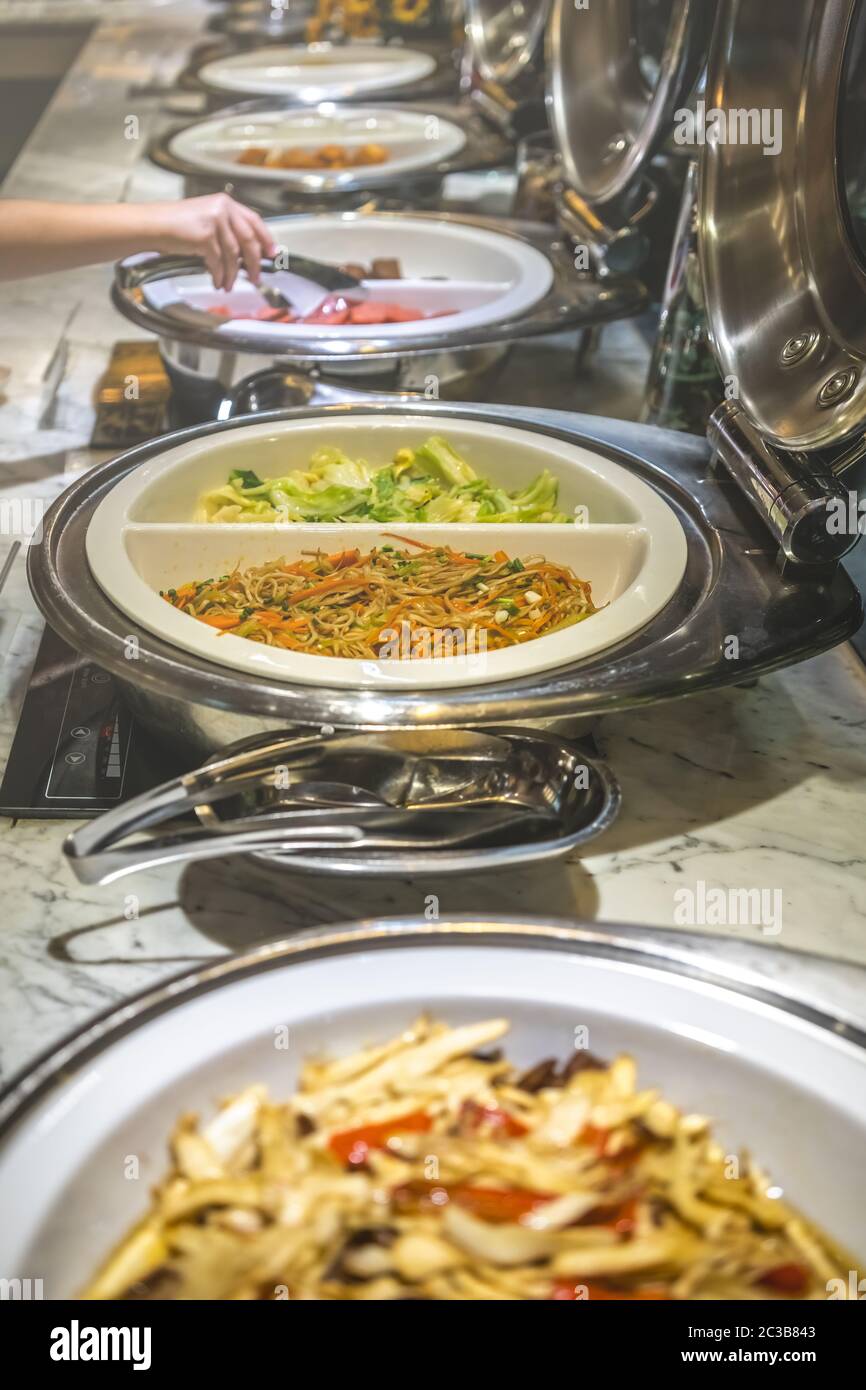 Fried noodles and boiled pakchoy in a serving bowl as a asian style ...