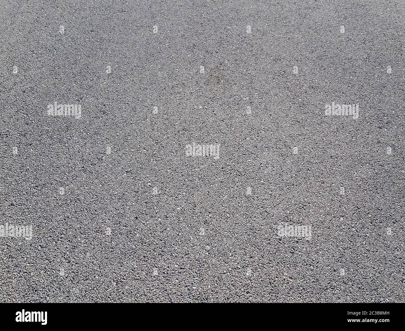 Light gray asphalt for pavement. The surface of the asphalt is smooth ...