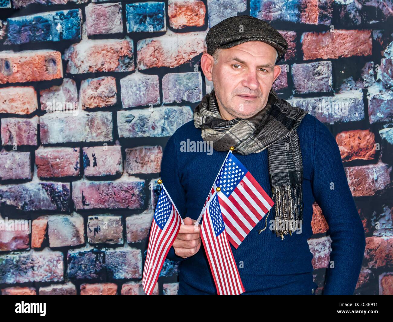 A man with an American flag in his hand on Independence Day ...