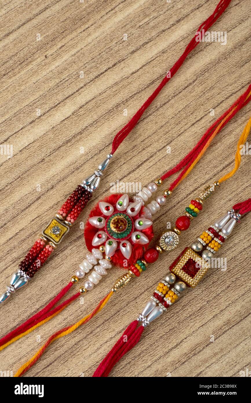 Raksha Bandhan background with an elegant Rakhi . A traditional Indian ...