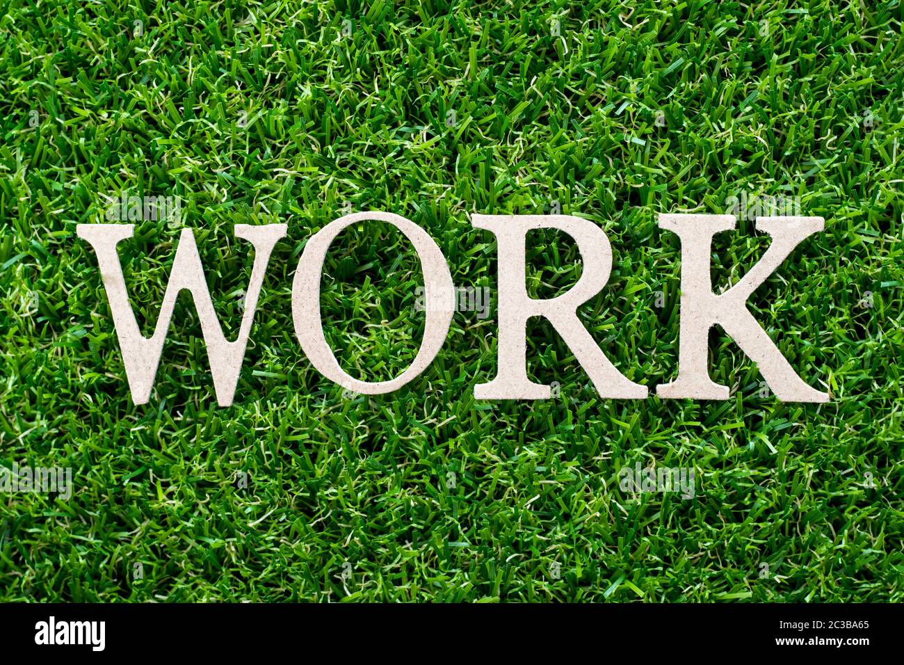 Wood letter in word work on artificial green grass background Stock ...