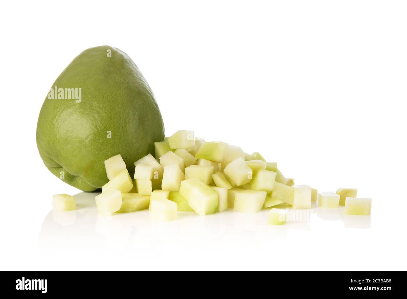 Fresh whole and cubed chayote squash isolated on a white background ...