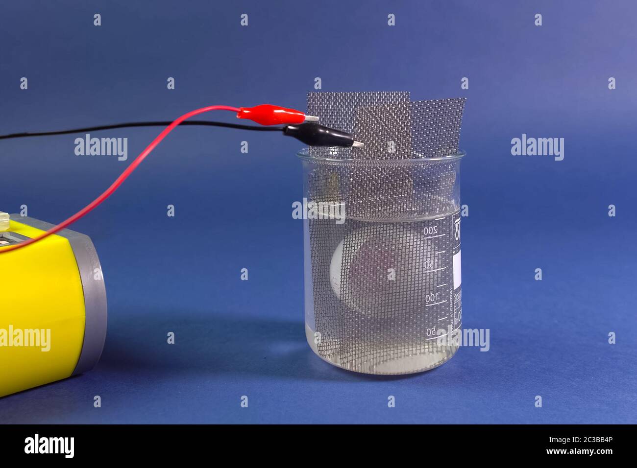 Checking the conductivity of the substance. Anode and cathode in a ...