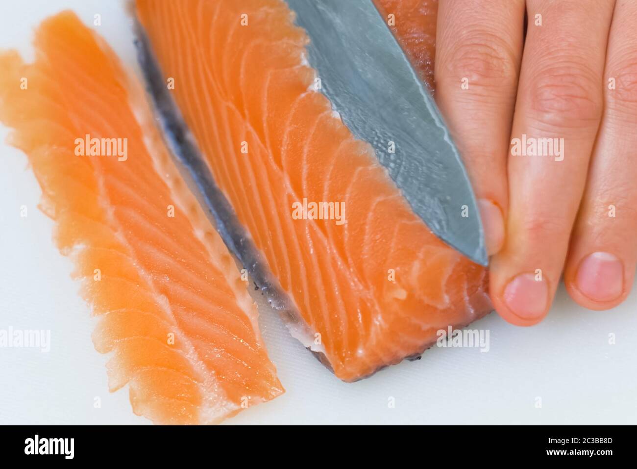 a Butchering salmon, piece of salmon red fish meat Stock Photo - Alamy