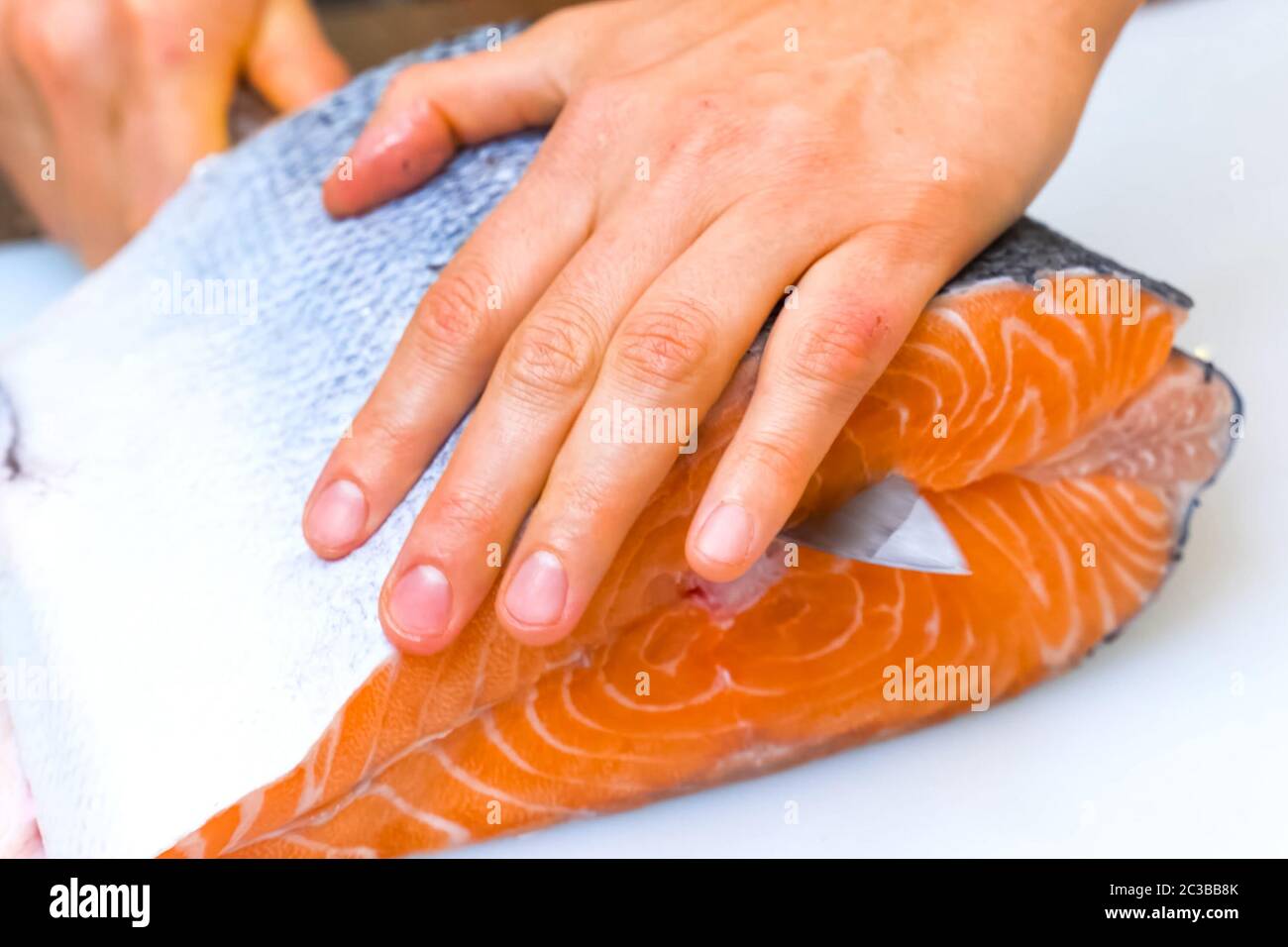 a Butchering salmon, piece of salmon red fish meat Stock Photo - Alamy
