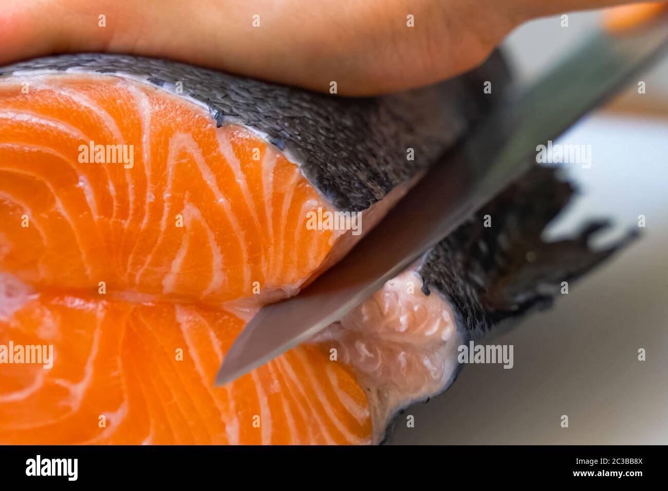 a Butchering salmon, piece of salmon red fish meat Stock Photo - Alamy