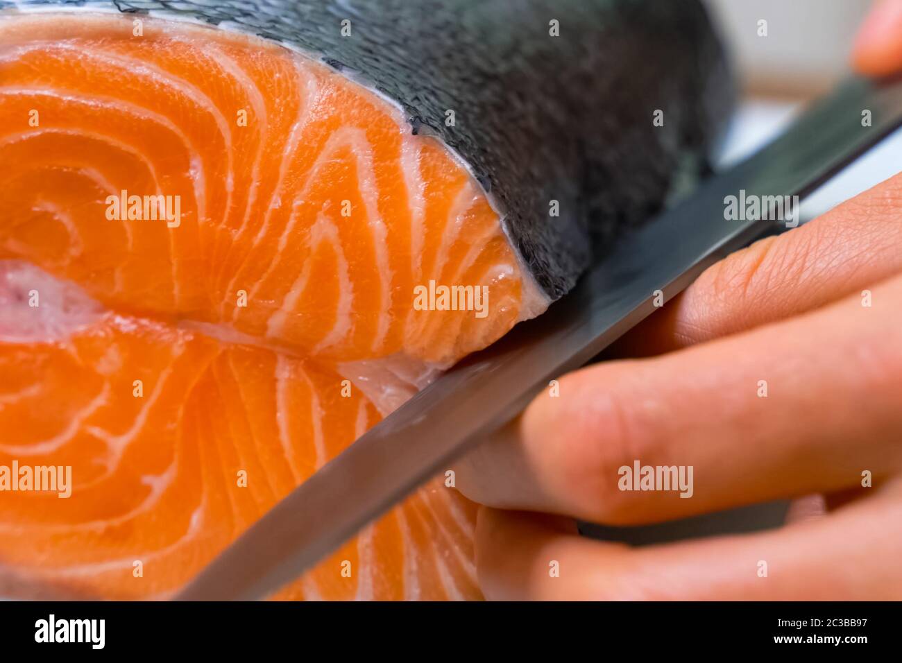 a Butchering salmon, piece of salmon red fish meat Stock Photo - Alamy