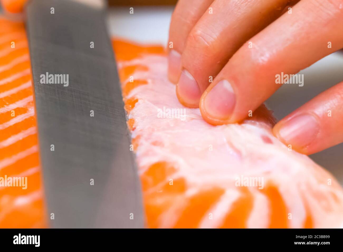 a Butchering salmon, piece of salmon red fish meat Stock Photo - Alamy