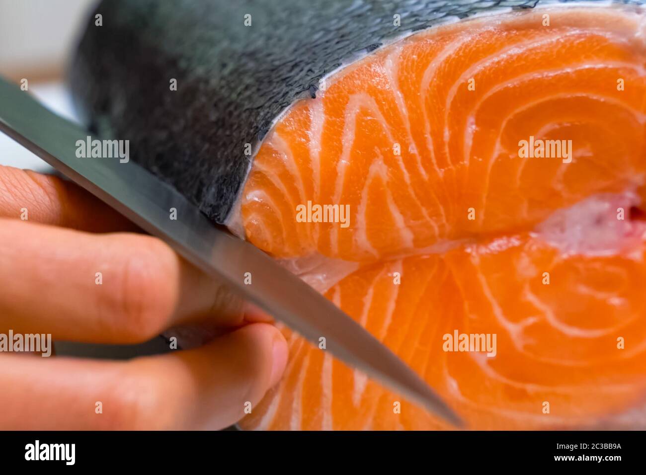 a Butchering salmon, piece of salmon red fish meat Stock Photo - Alamy