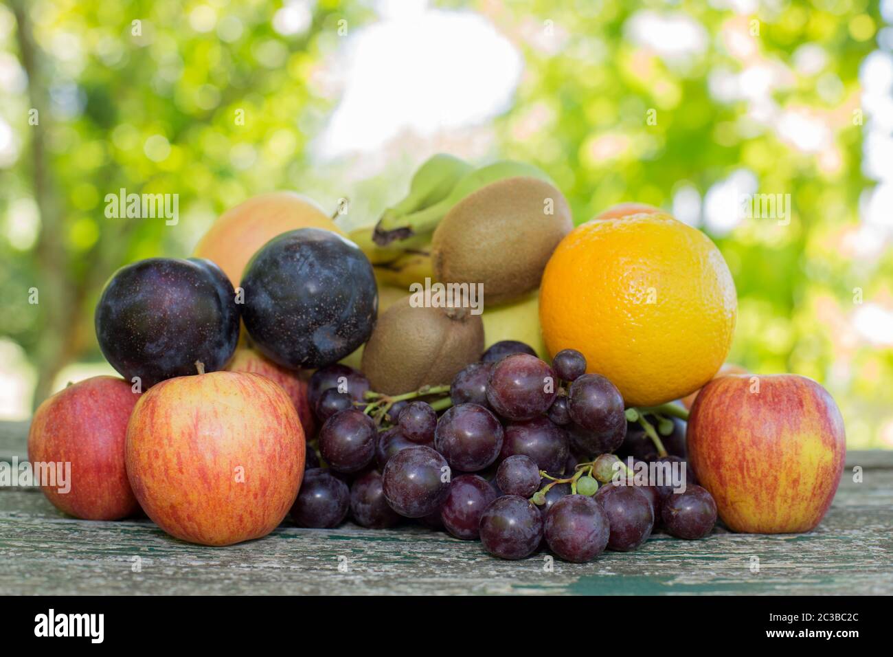 fruits in wooden table, outdoor Stock Photo - Alamy