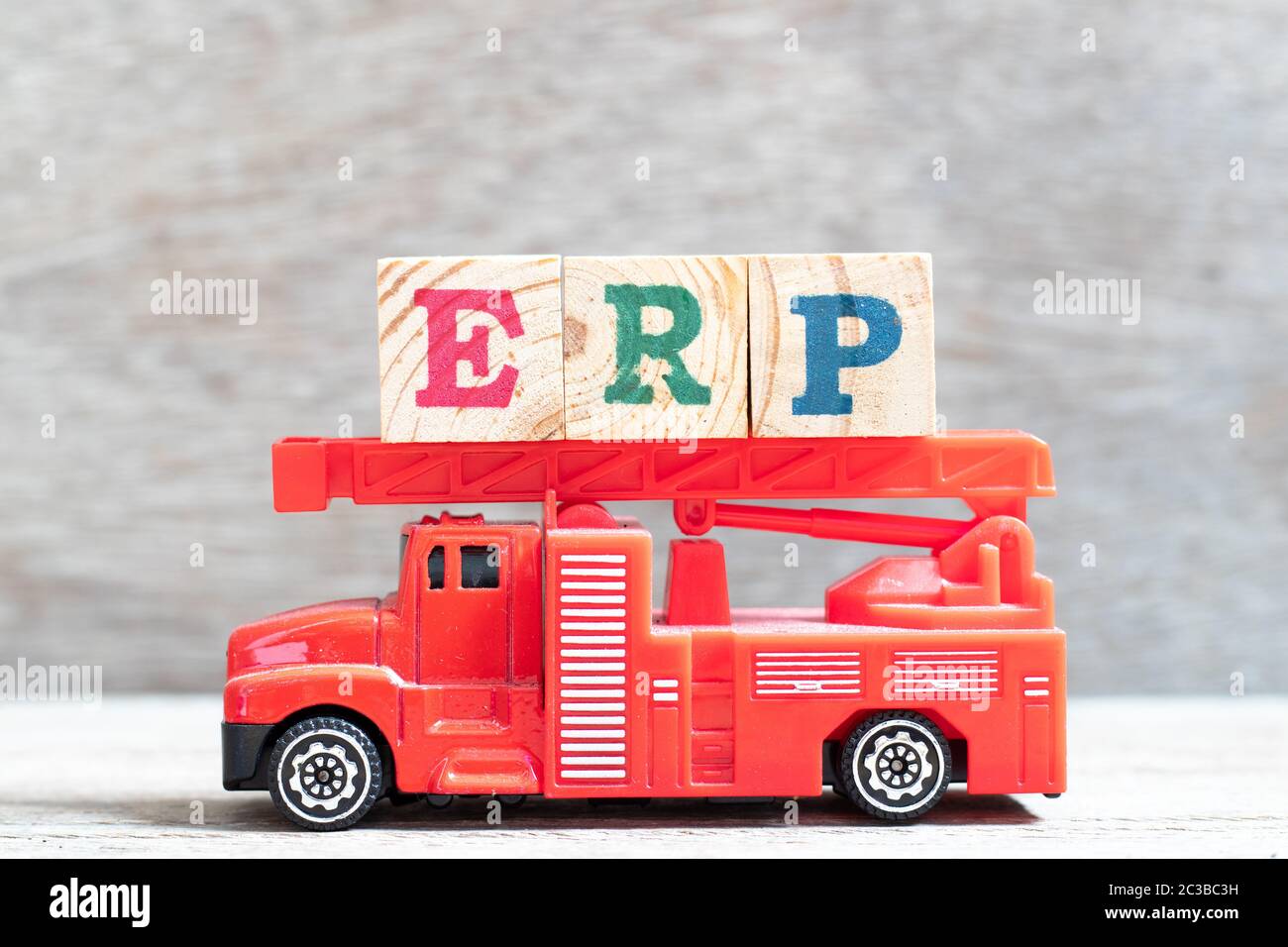 Red fire truck hold letter block in word ERP (Abbreviation of ...