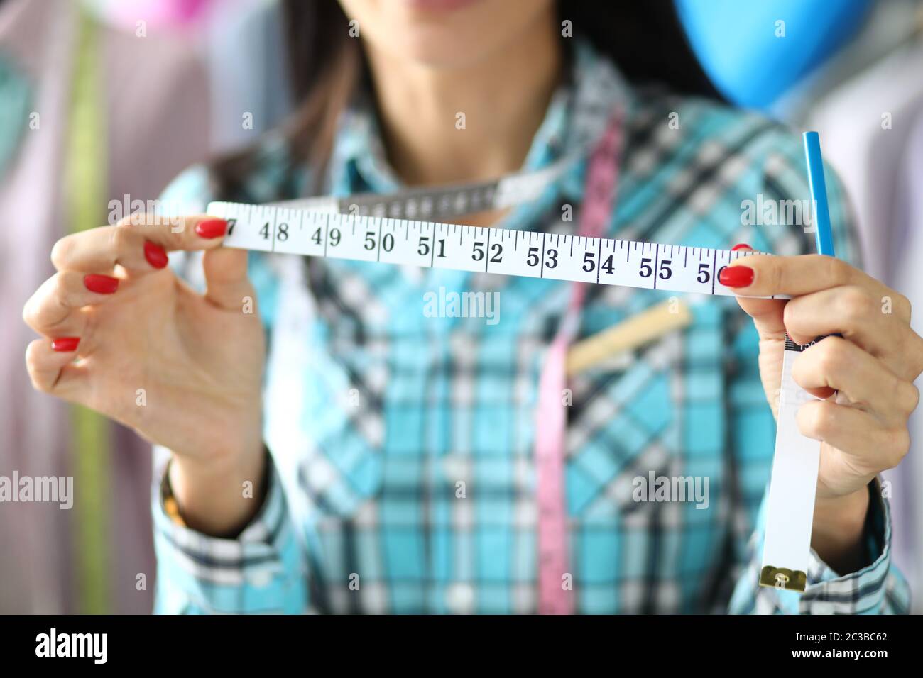 Holds measuring tape hi-res stock photography and images - Alamy