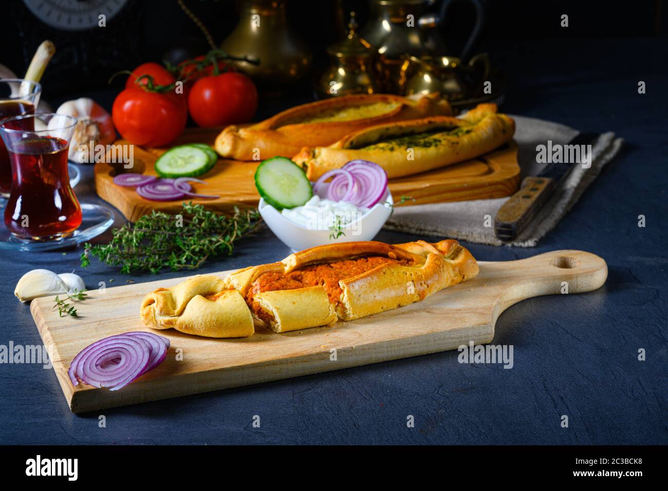 Pide with minced meat, spinach feta and sheep's cheese Stock Photo - Alamy