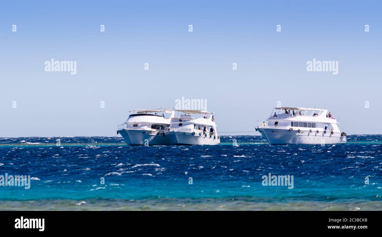 three white pleasure boat in the Red Sea in Egypt Dahab South Sinai ...
