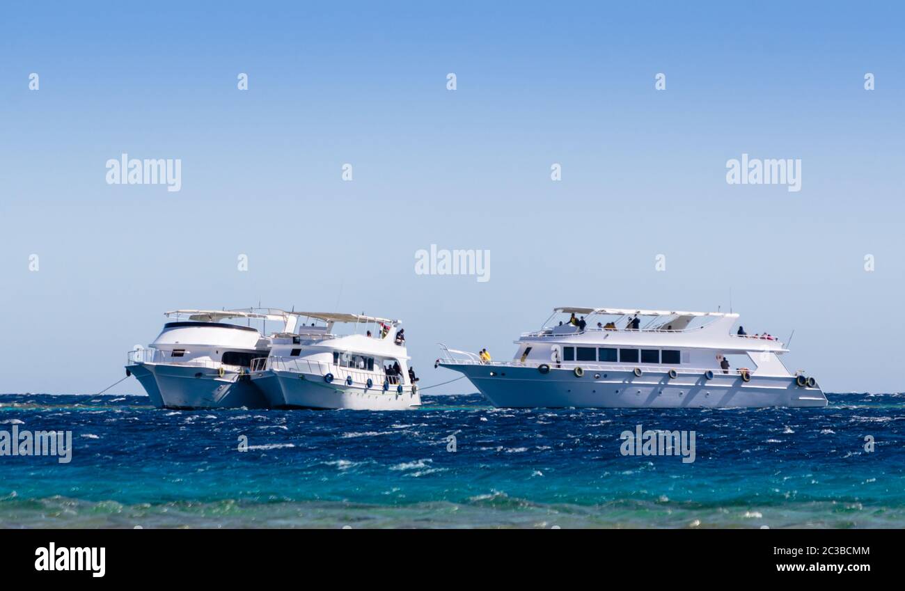 three white pleasure boat in the Red Sea in Egypt Dahab South Sinai ...