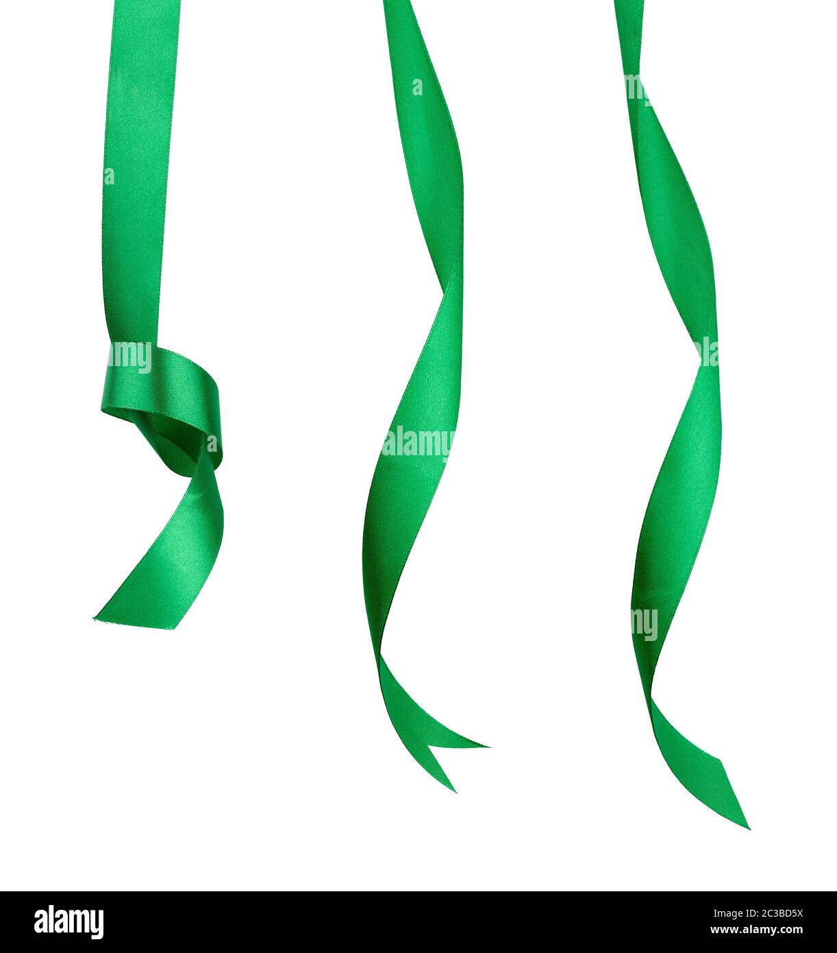 set of twisted green silk ribbon ends with knots isolated on white ...