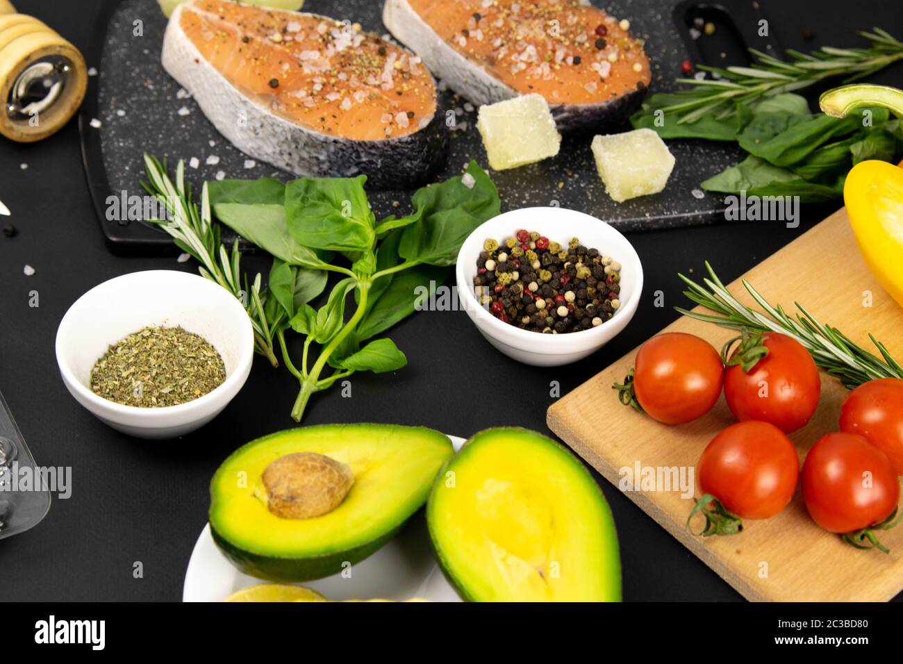 A set of healthy balanced super food, avocado in the foreground, fresh ...