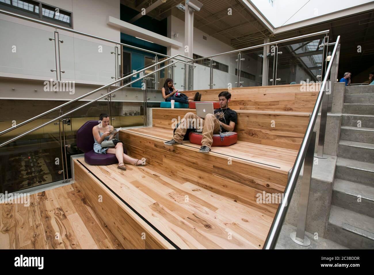 Austin, Texas USA, August 27, 2014: Students relax and read on benches ...
