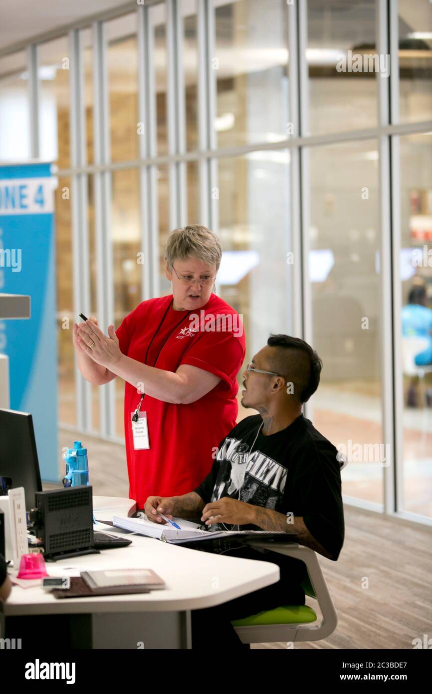 Austin, Texas USA, August 27, 2014: Tutor talks to student inside the ...