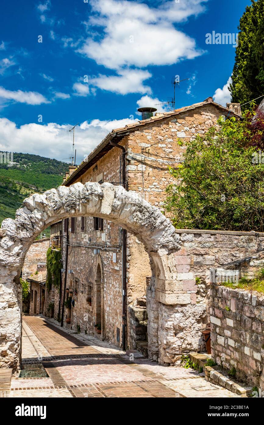 The paved alleys of the village and the stone and brick houses. A Roman ...