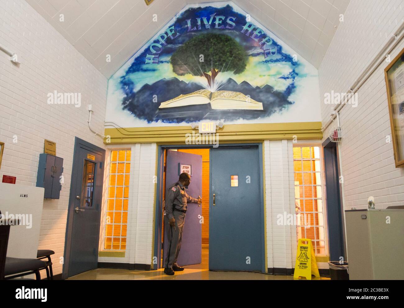 Rosharon Texas USA, May 9, 2015: Male guard opens door of chapel inside ...
