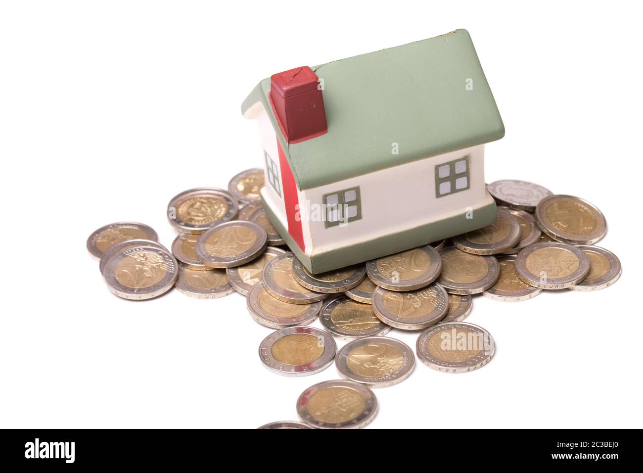 small house and coins, concept, isolated on white background Stock ...